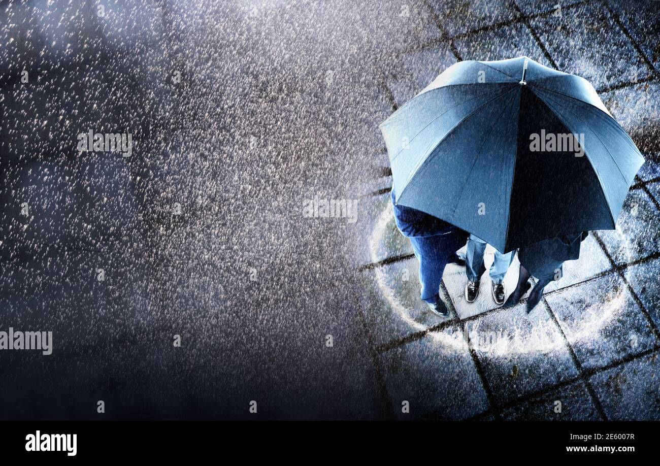 Group under one umbrella hi-res stock photography and images - Alamy