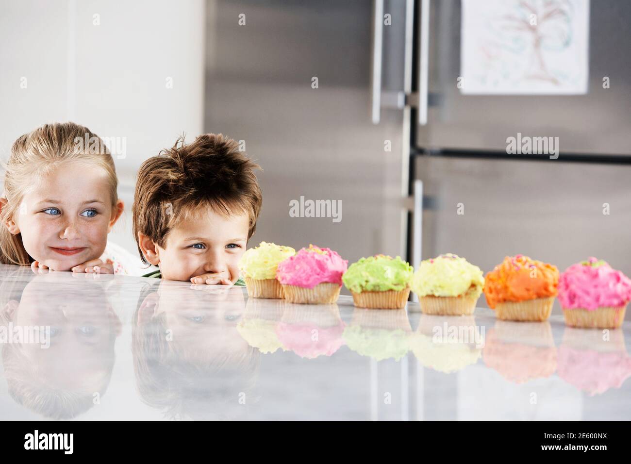Girl peeking over table hi-res stock photography and images - Alamy