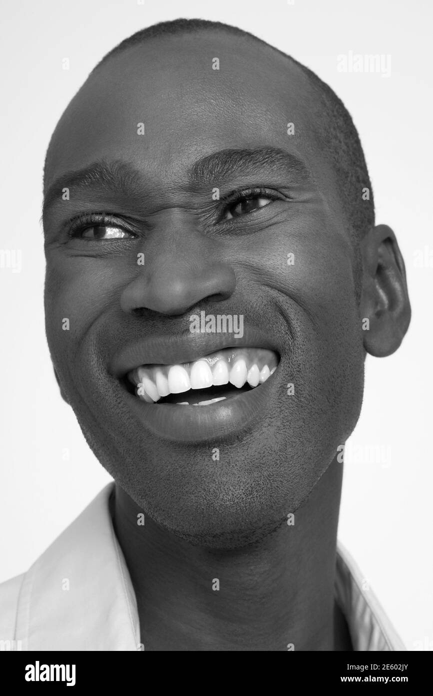 Black and white photo of african man smiling Stock Photo - Alamy