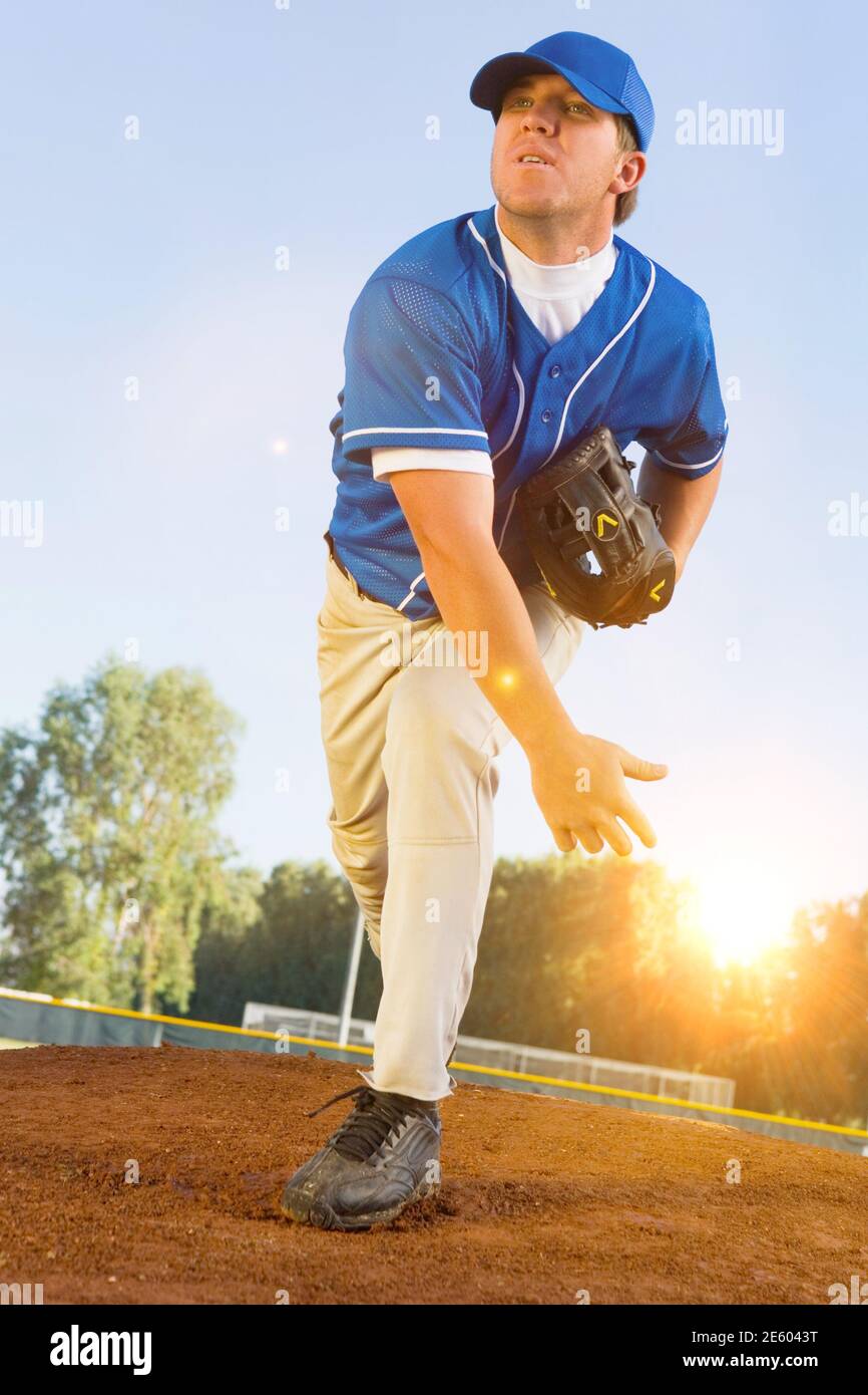 Photo of Baseball Pitcher throwing the ball Stock Photo - Alamy