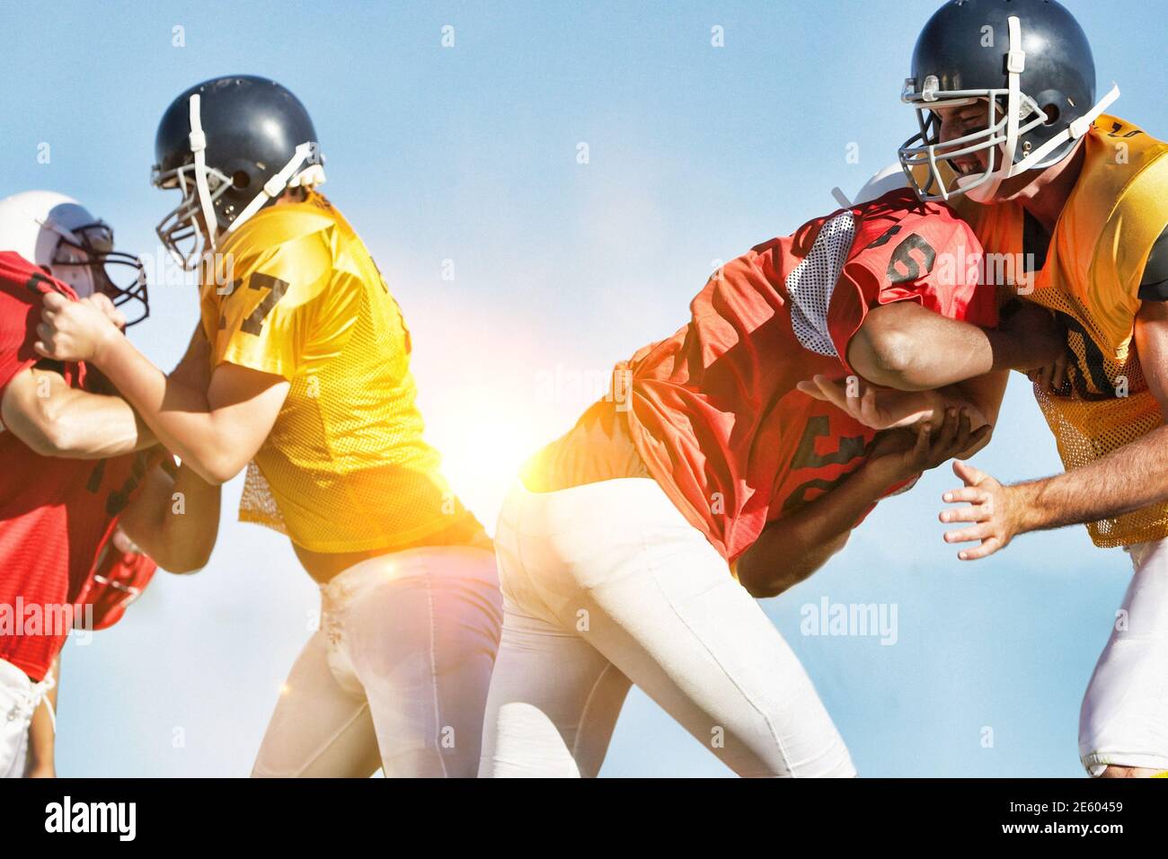 Photo of Football Players Tackling Stock Photo - Alamy