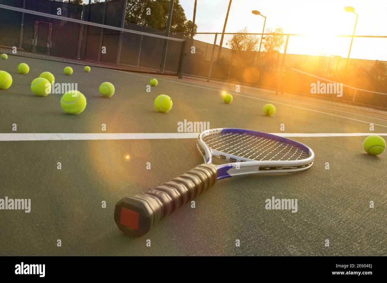 Tennis Racket and Balls on Court Stock Photo - Alamy