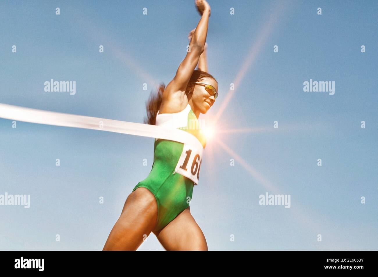 Sprinter crossing finish line hi-res stock photography and images - Alamy