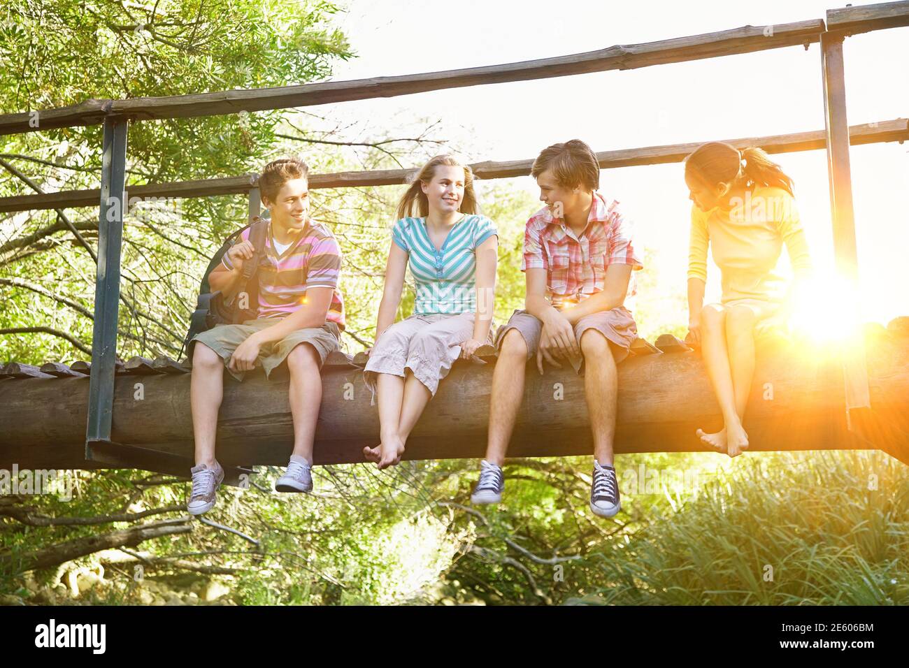 Boys sitting on bridge hi-res stock photography and images - Alamy