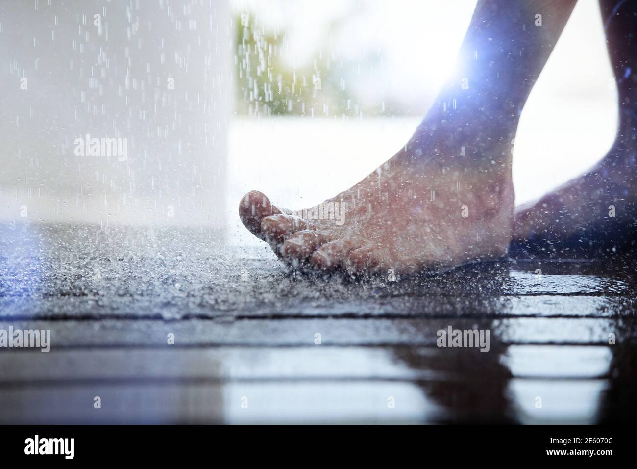 Close up photo of Foot Under Dripping Water Stock Photo - Alamy