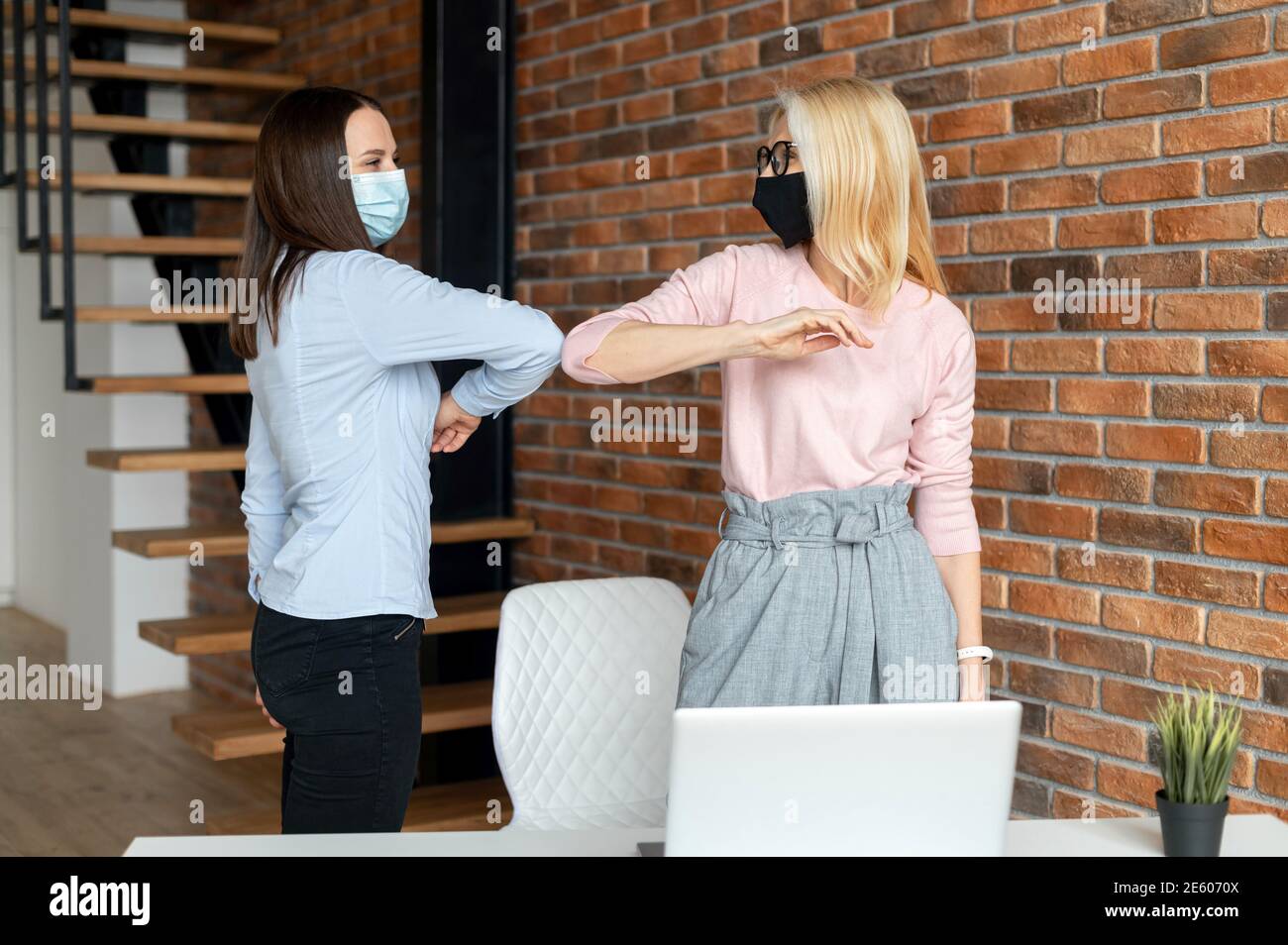 Greetings in the office during a pandemic, alternative handshake ...