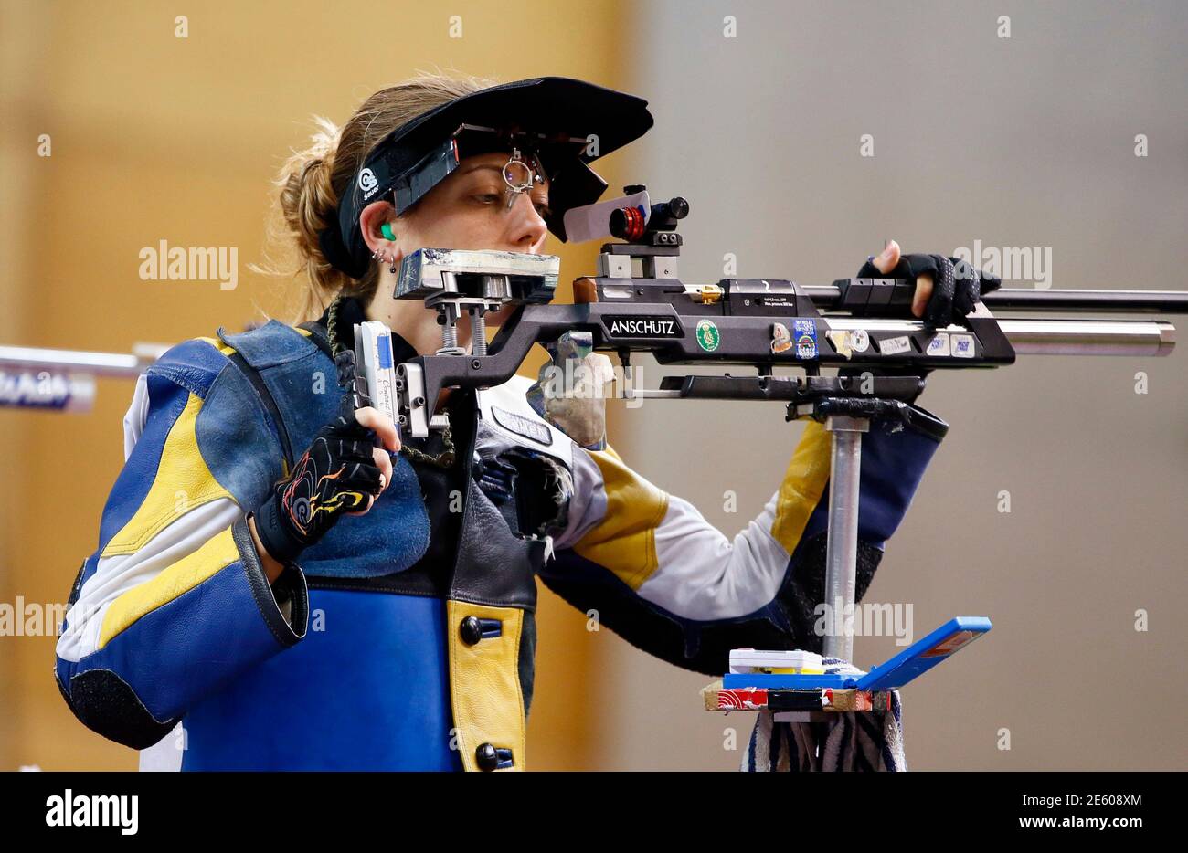 Jamie Lynn Gray of the U.S. checks her rifle during the women's 10m air ...