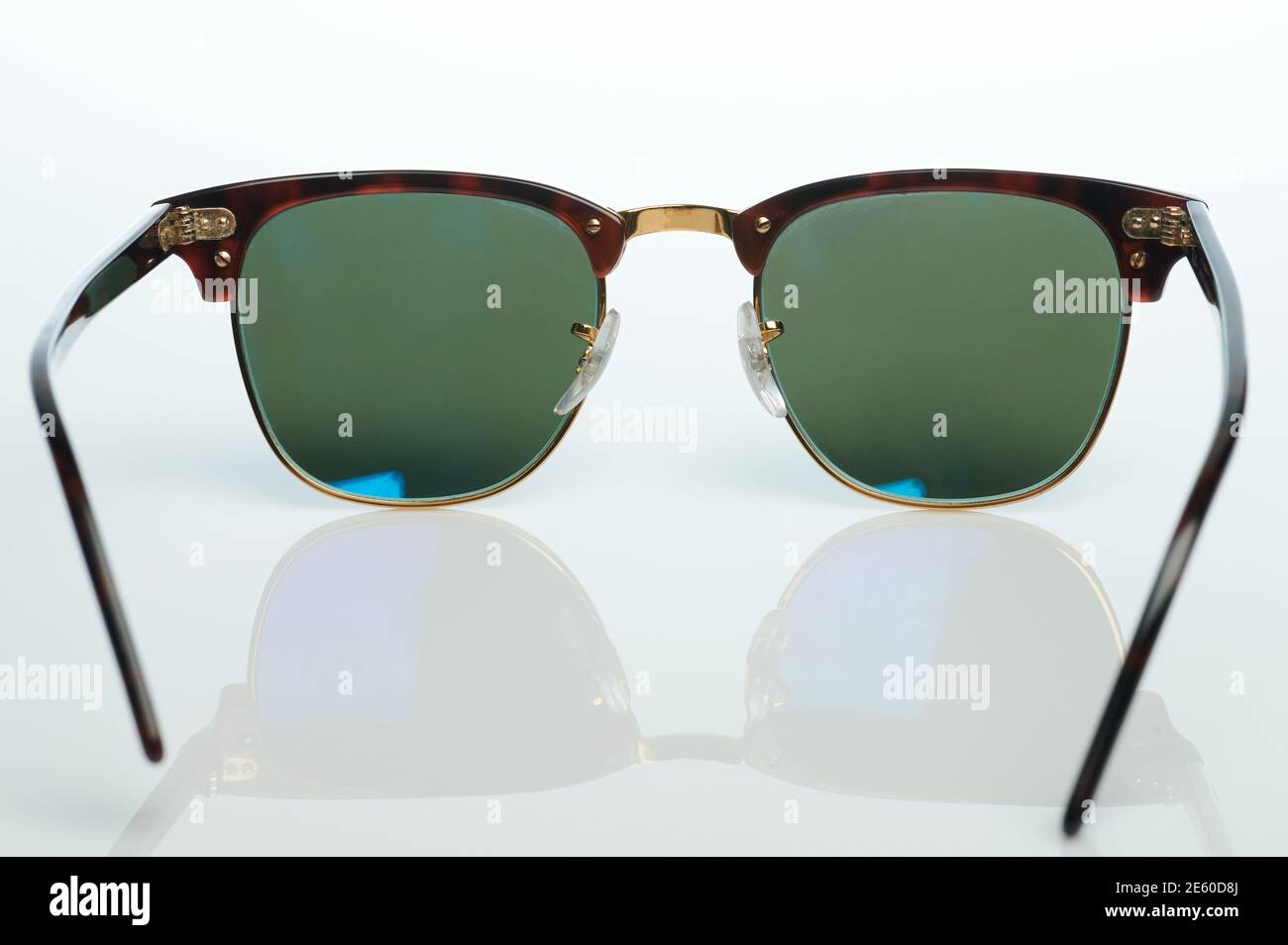Sunglasses shade isolated back view with green glass Stock Photo - Alamy