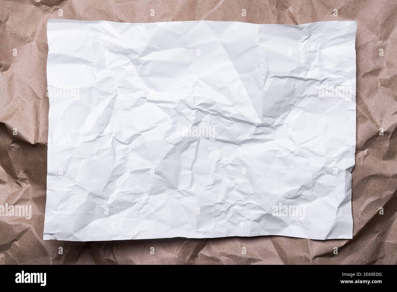 crumpled cream craft paper like a frame, and white paper, background ...