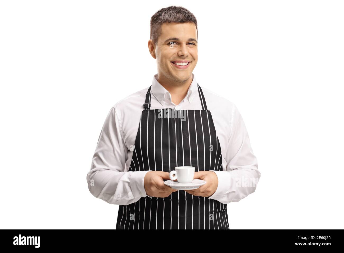 Man with an apron holding an espresso coffee and smiling at camera ...