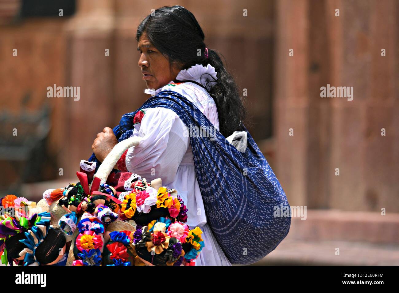 Indigenous woman selling the authentic colorful, handmade traditional ...