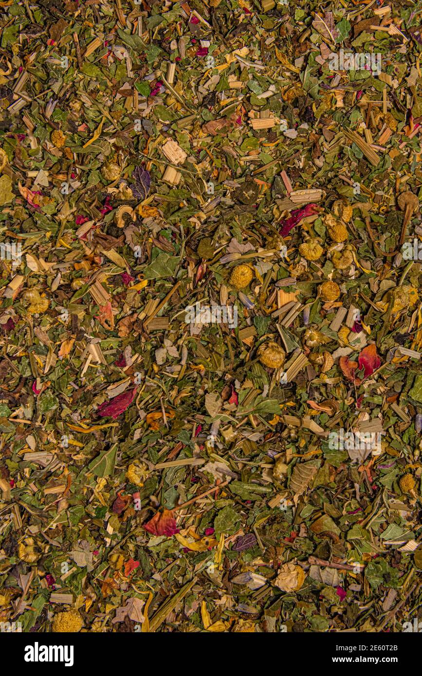 Background made from a mixture of dried healthy herbs with different ...