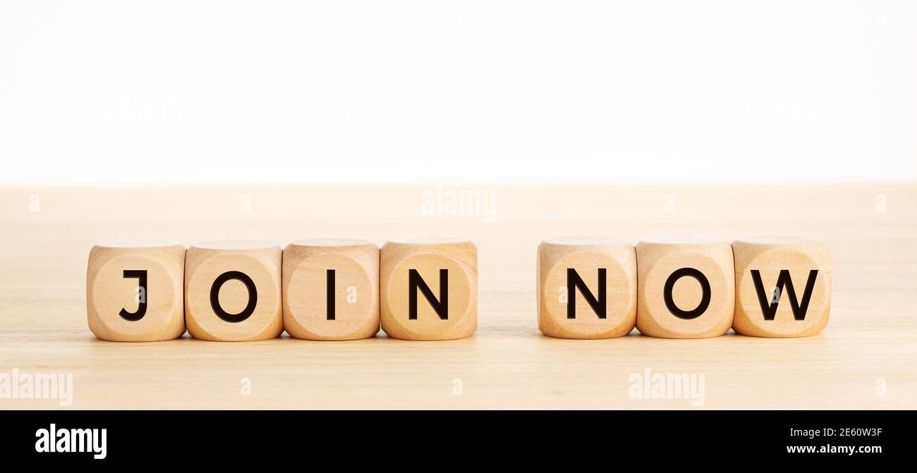 Join now word on wooden blocks on wood table. Copy space. White ...