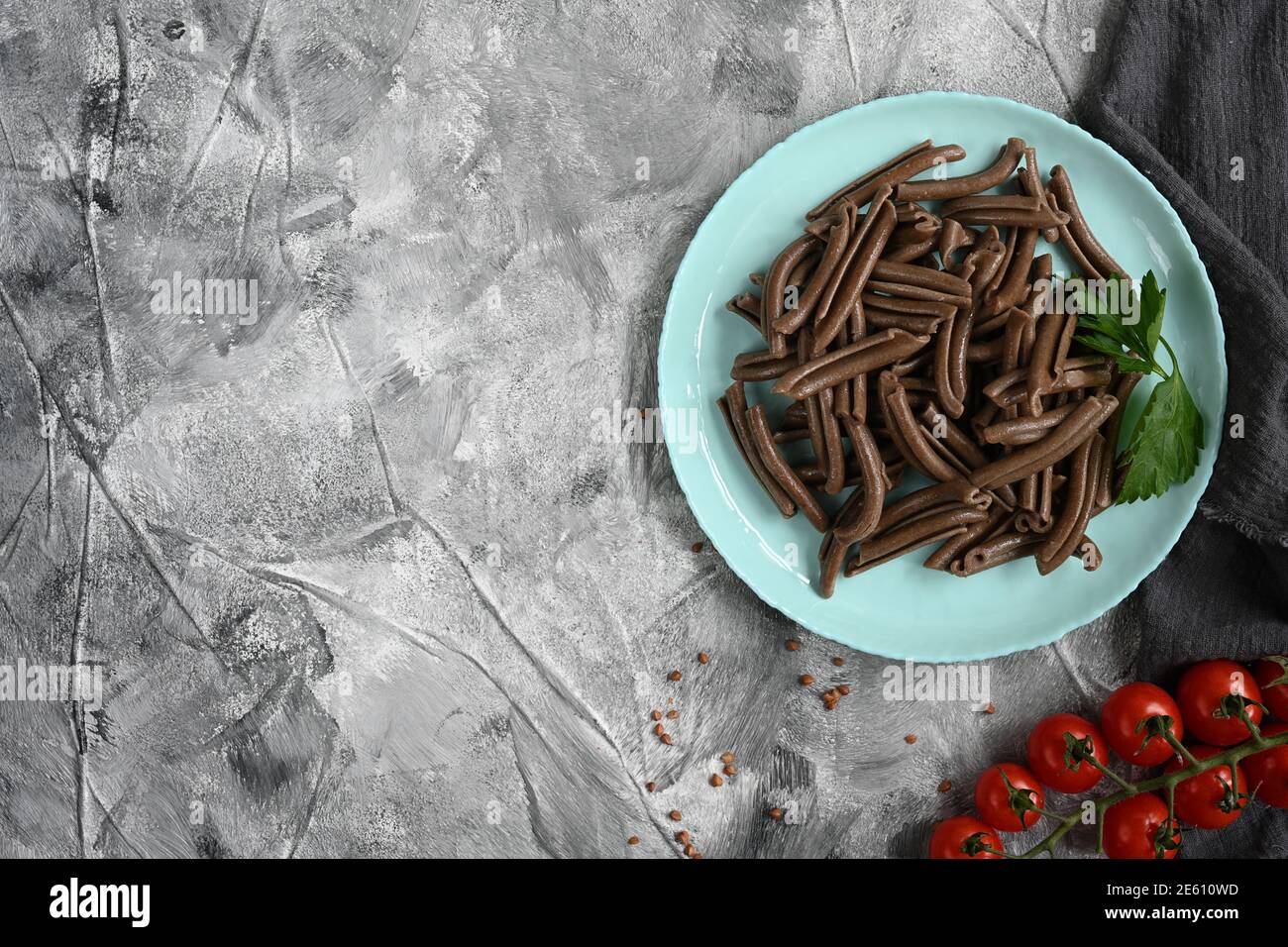 buckwheat spaghetti. Buckwheat pasta on a light grey table. Asian soba ...