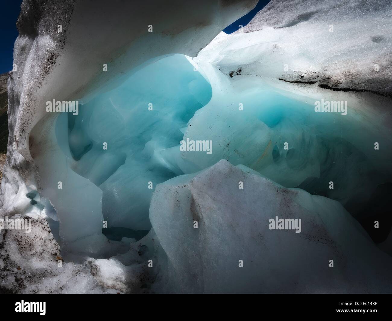 holes, faults and cracks of ice inside a mountain glacier background ...