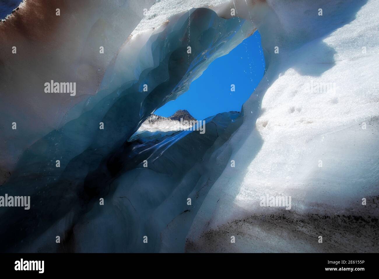 holes, faults and cracks of ice inside a mountain glacier background ...