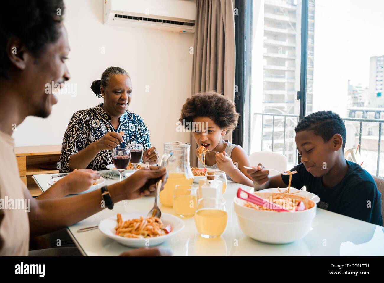 His family having lunch hi-res stock photography and images - Alamy
