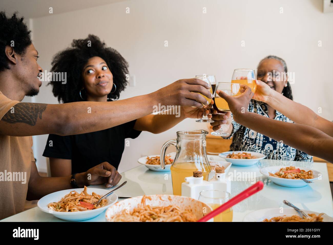 Family having lunch together at home Stock Photo - Alamy