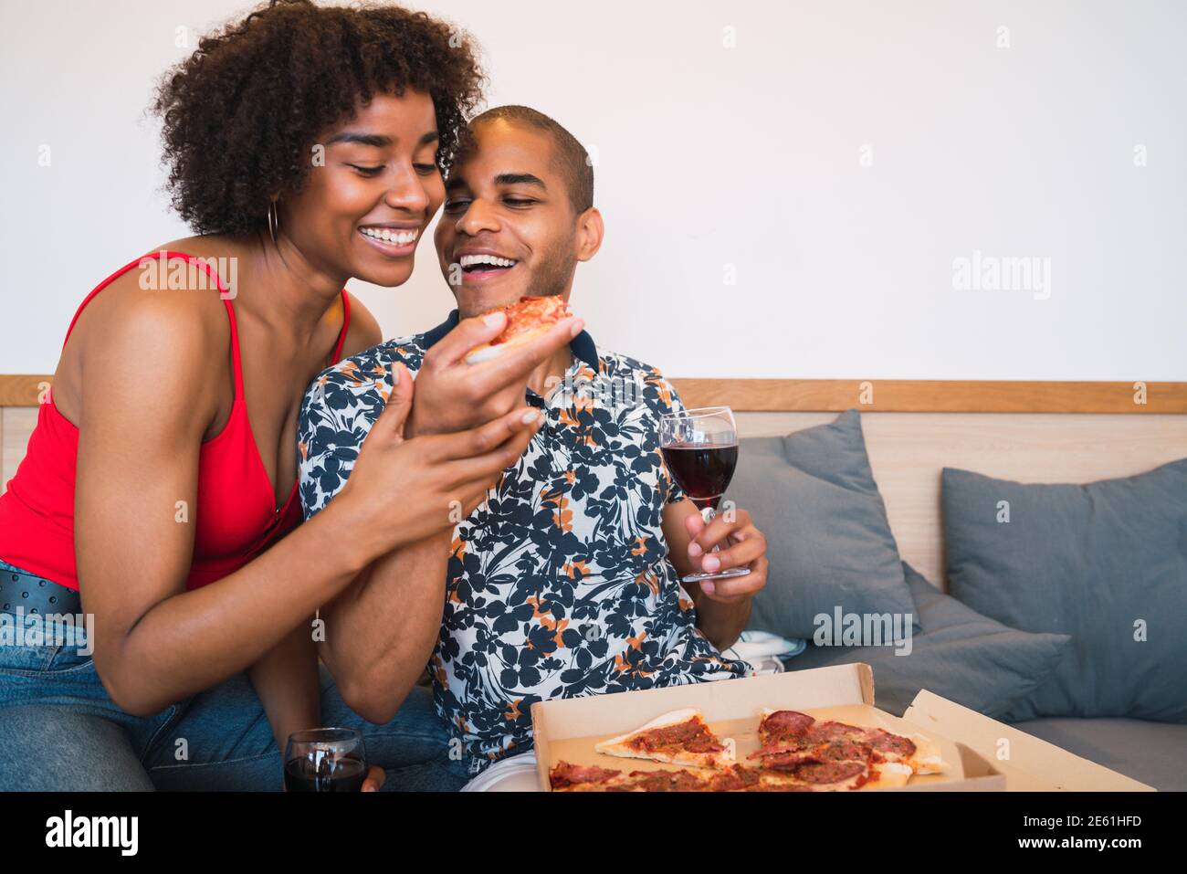Happy latin couple having dinner together Stock Photo - Alamy