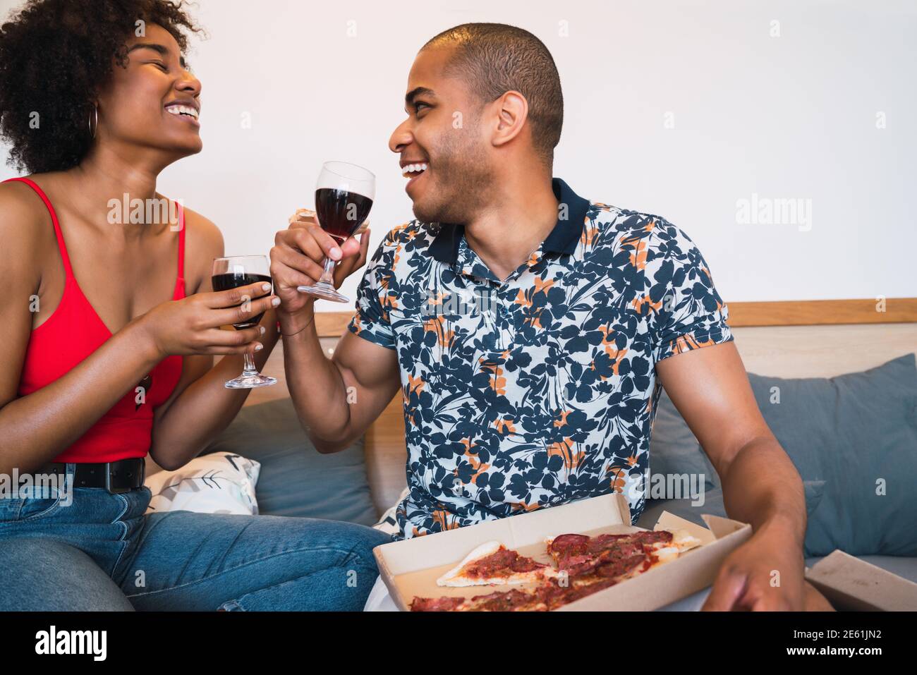 Happy latin couple having dinner together Stock Photo - Alamy