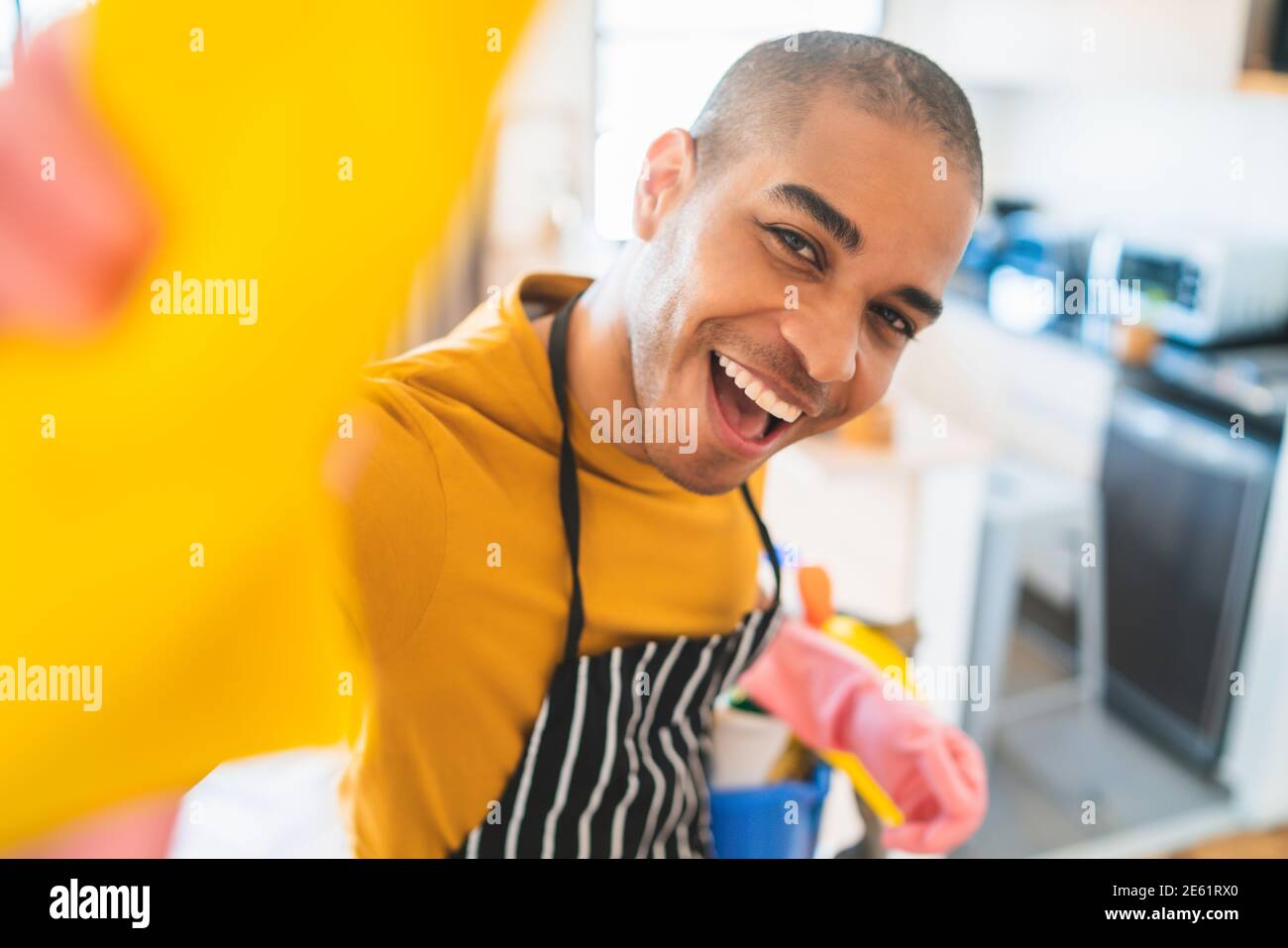 Latin man cleaning new home Stock Photo - Alamy
