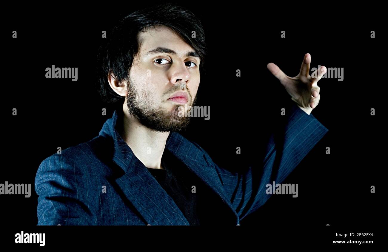 Man posing with his left hand up hi-res stock photography and images ...