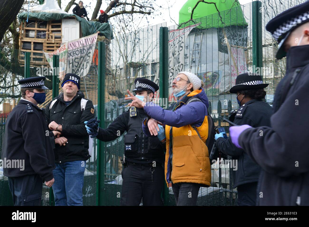 Protesters from StopHS2 are arrested and handcuffed by police during ...