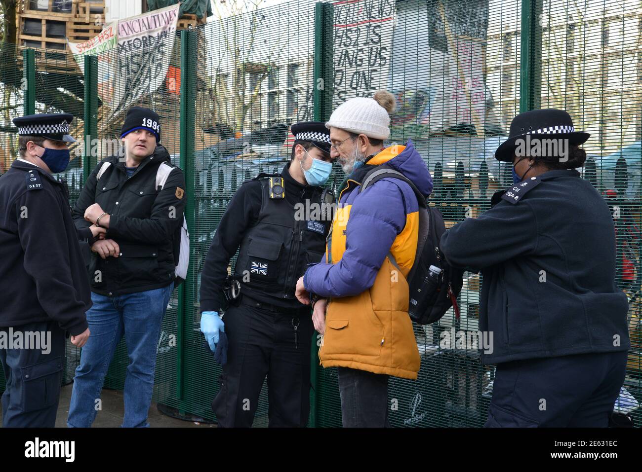 Protestors are arrested and handcuffed by police during the ...