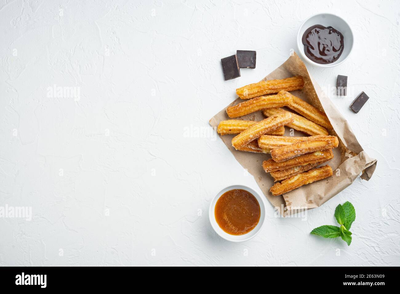Churros with chocolate, Traditional Spanish cusine, on white background ...