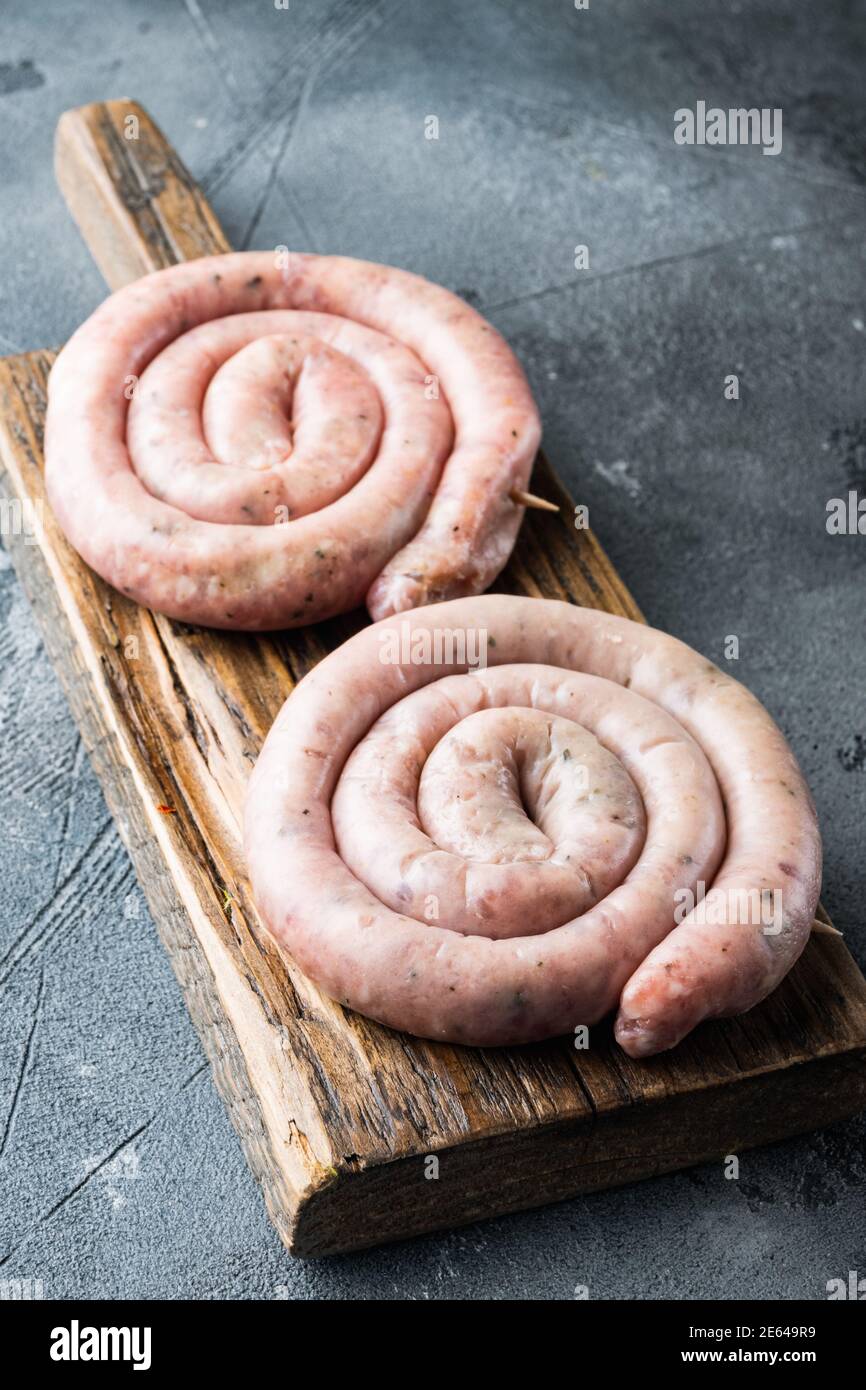 Raw snail sausage in traditional spiral set, on gray background Stock ...