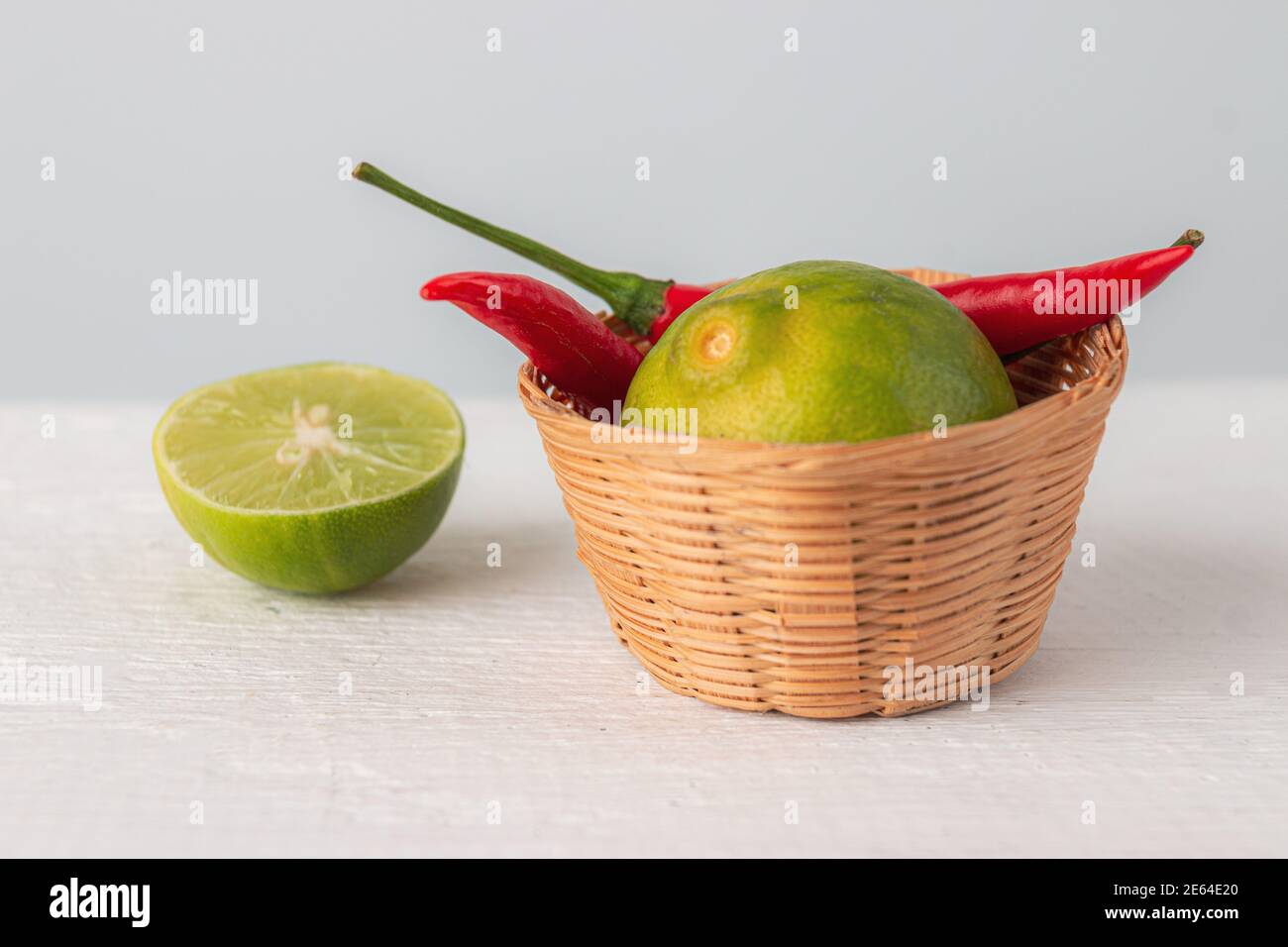Red chilli and lemon For cooking Thai food on white wooden table Stock ...