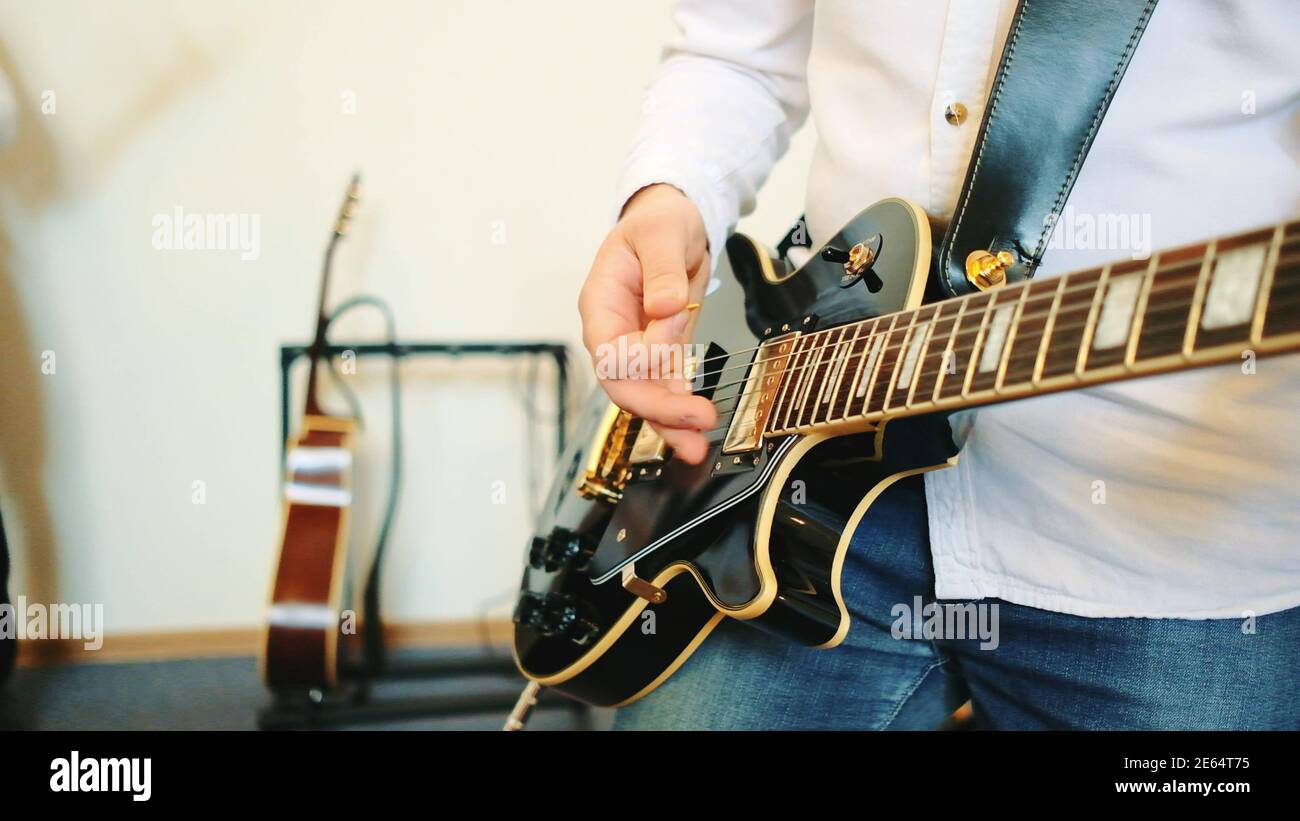 Man playing guitar band close hi-res stock photography and images - Alamy