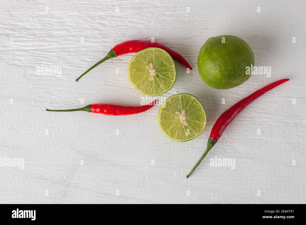 Red chilli and lemon For cooking Thai food on white wooden table Stock ...