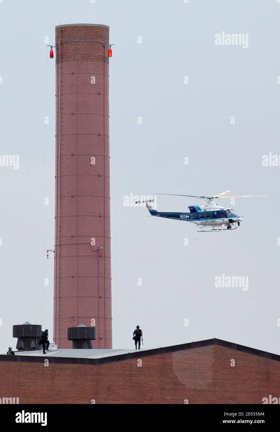 Police helicopter flies hi-res stock photography and images - Alamy