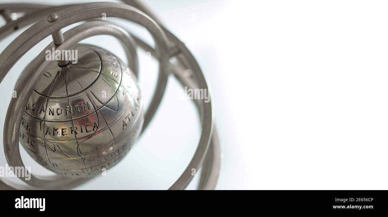 The silver metal globe shows the Americas on a white background Stock ...
