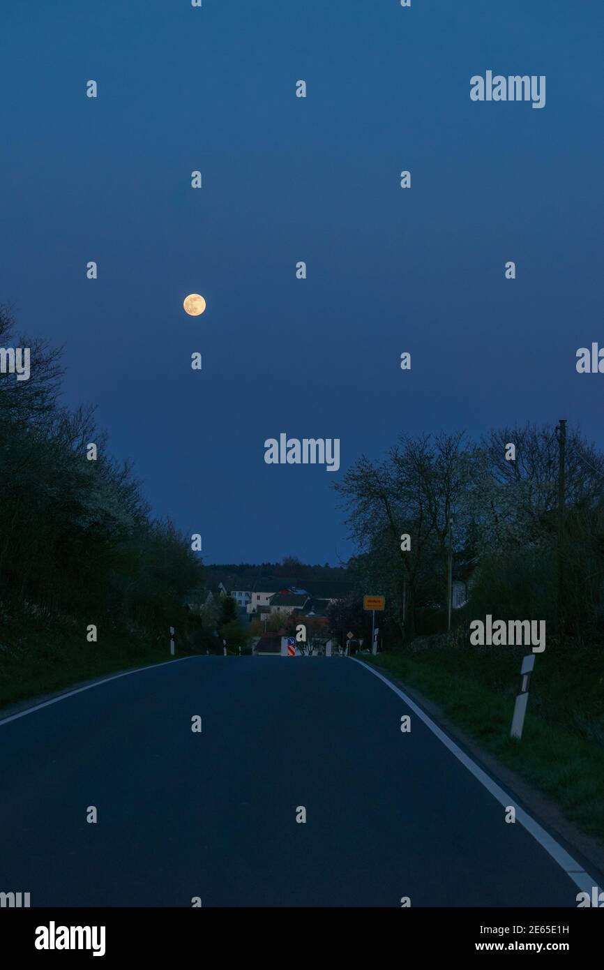 Moon over village hi-res stock photography and images - Alamy