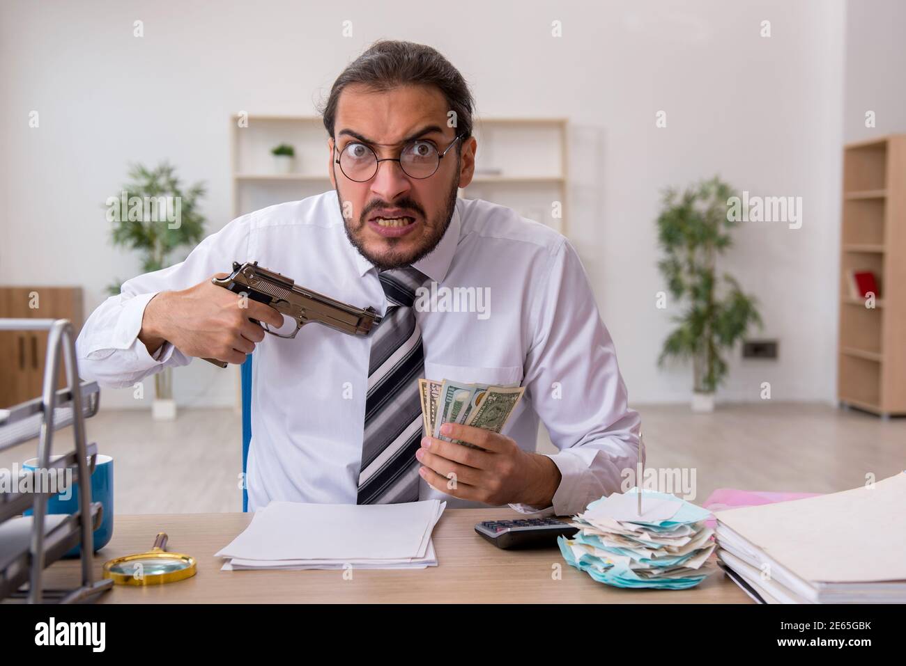 Angry bookkeeper in bankruptcy concept Stock Photo - Alamy