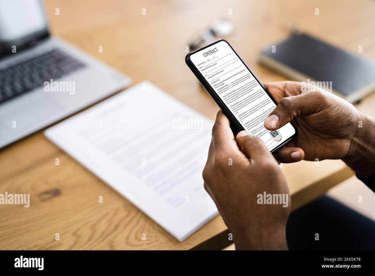 African Taking Picture Of Paper Document Using Smartphone Stock Photo ...