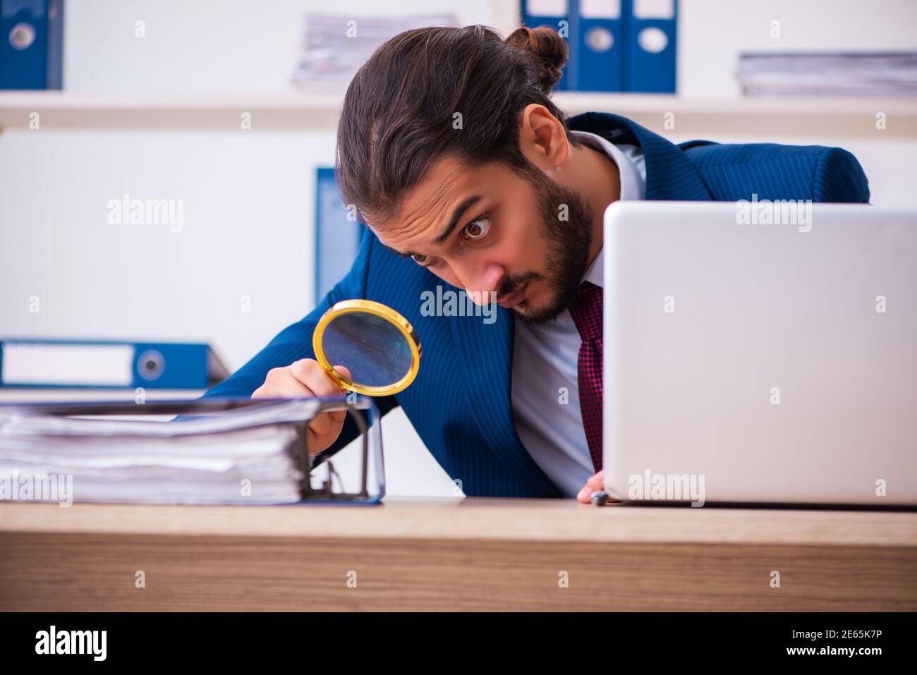 Young employee and too many work in the office Stock Photo - Alamy
