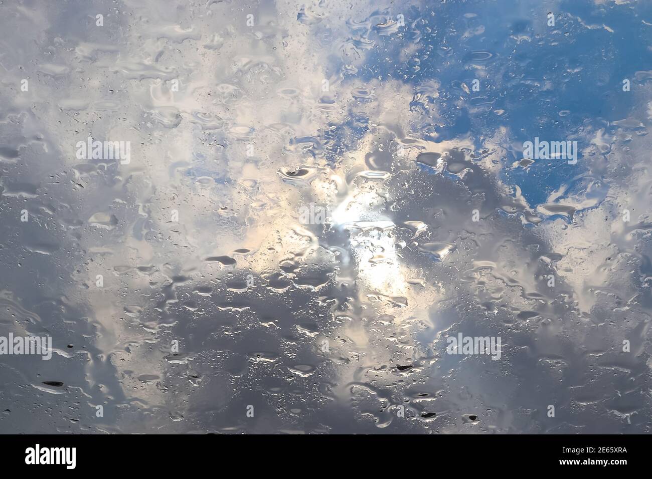 Rain drops running down a car window in a close up view Stock Photo - Alamy