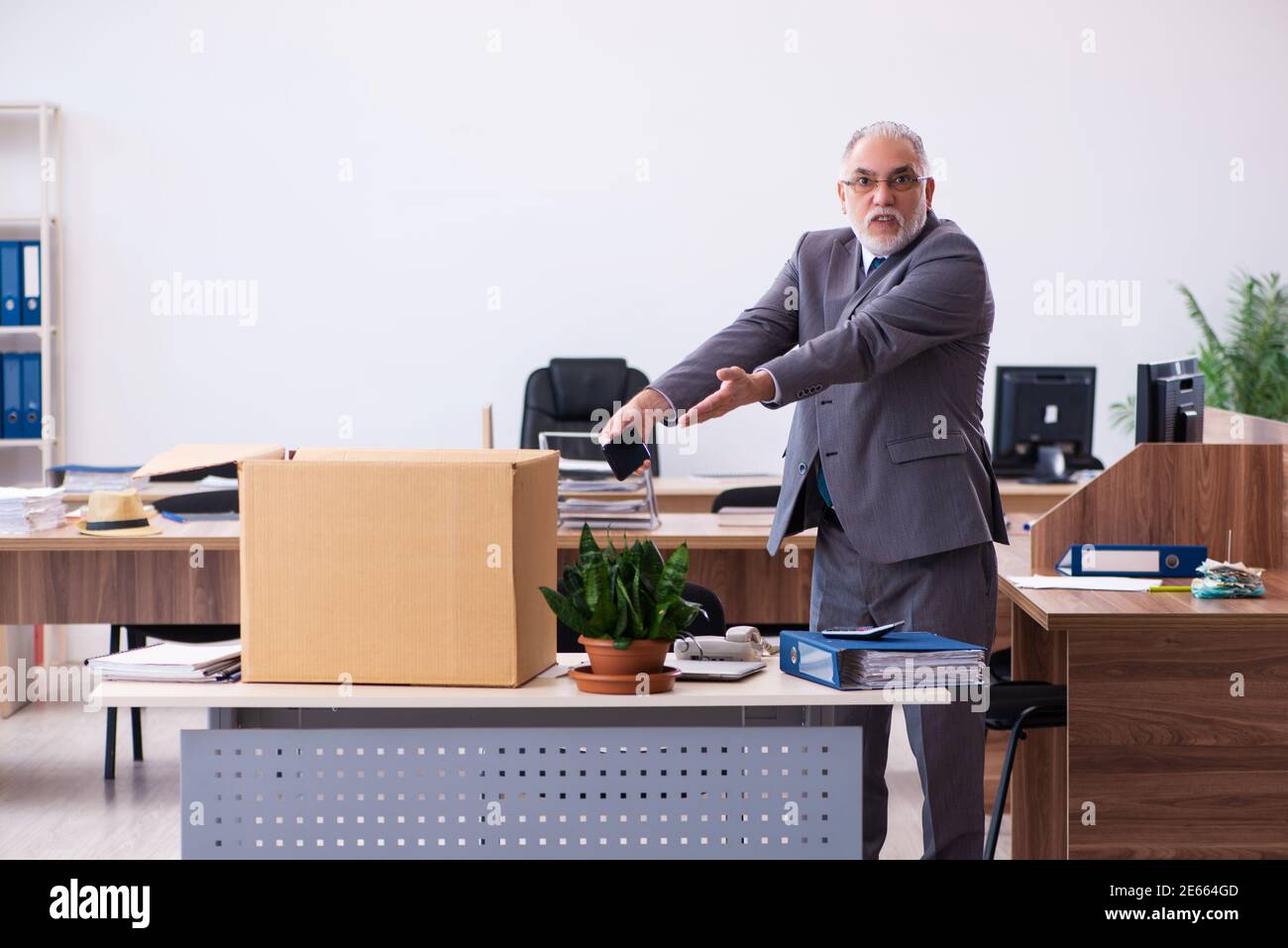 Old employee being fired from his work Stock Photo - Alamy