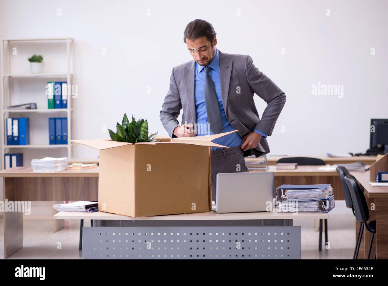 Young employee being fired from his work Stock Photo - Alamy