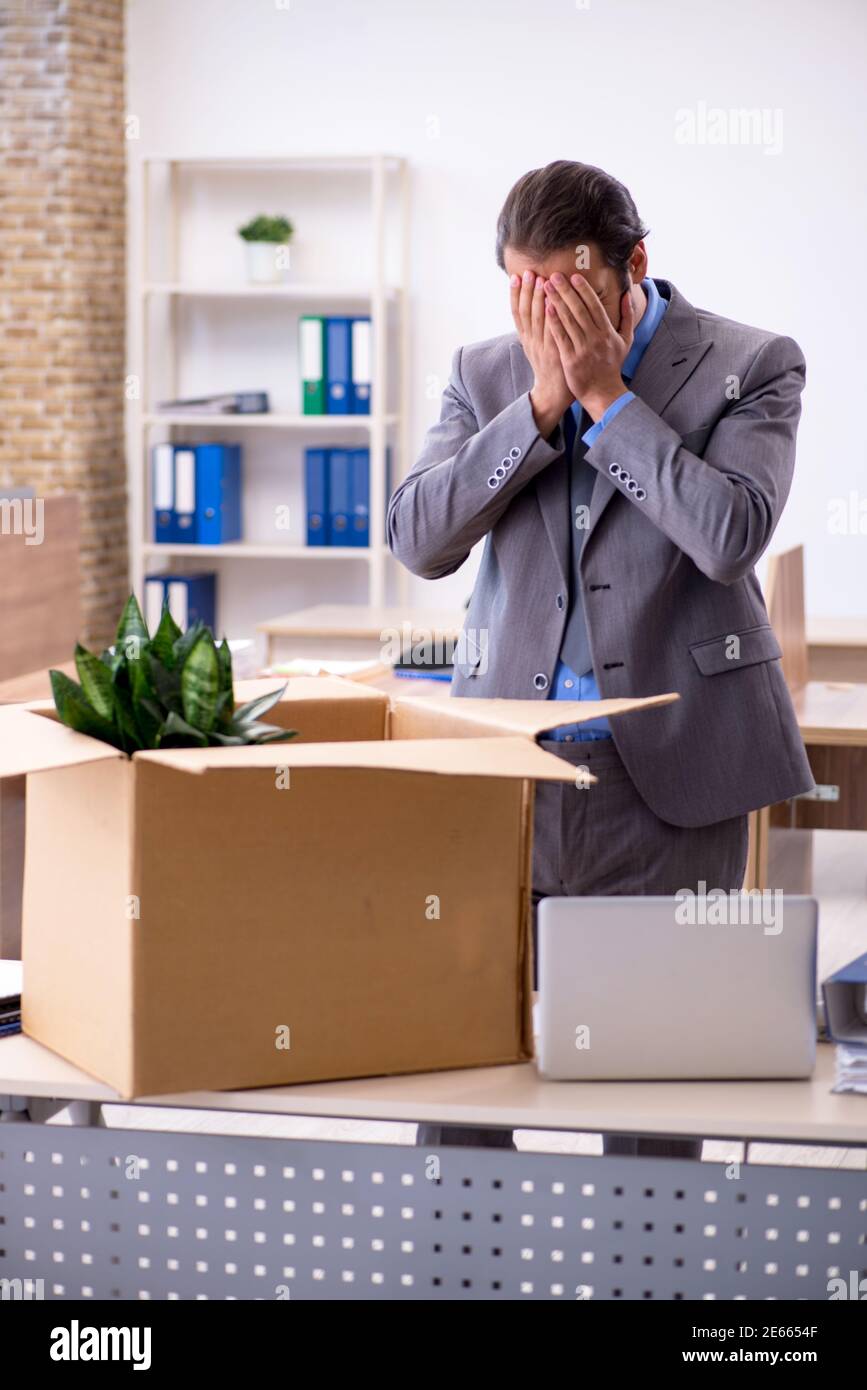 Young employee being fired from his work Stock Photo - Alamy