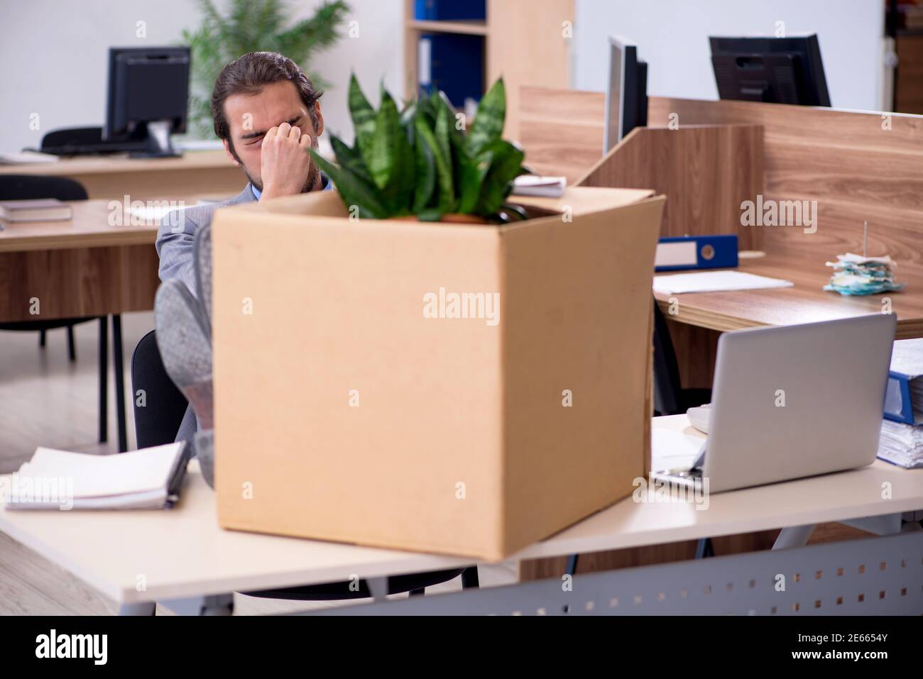 Young employee being fired from his work Stock Photo - Alamy