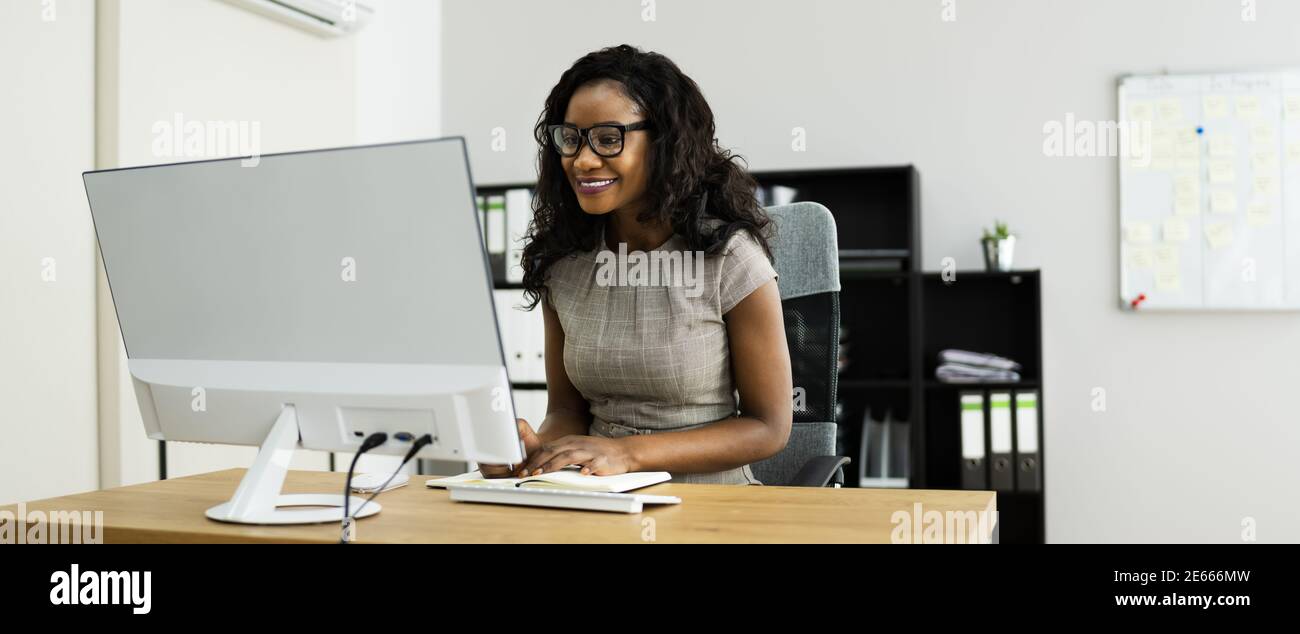 Happy African American Business Woman Using Computer Stock Photo - Alamy