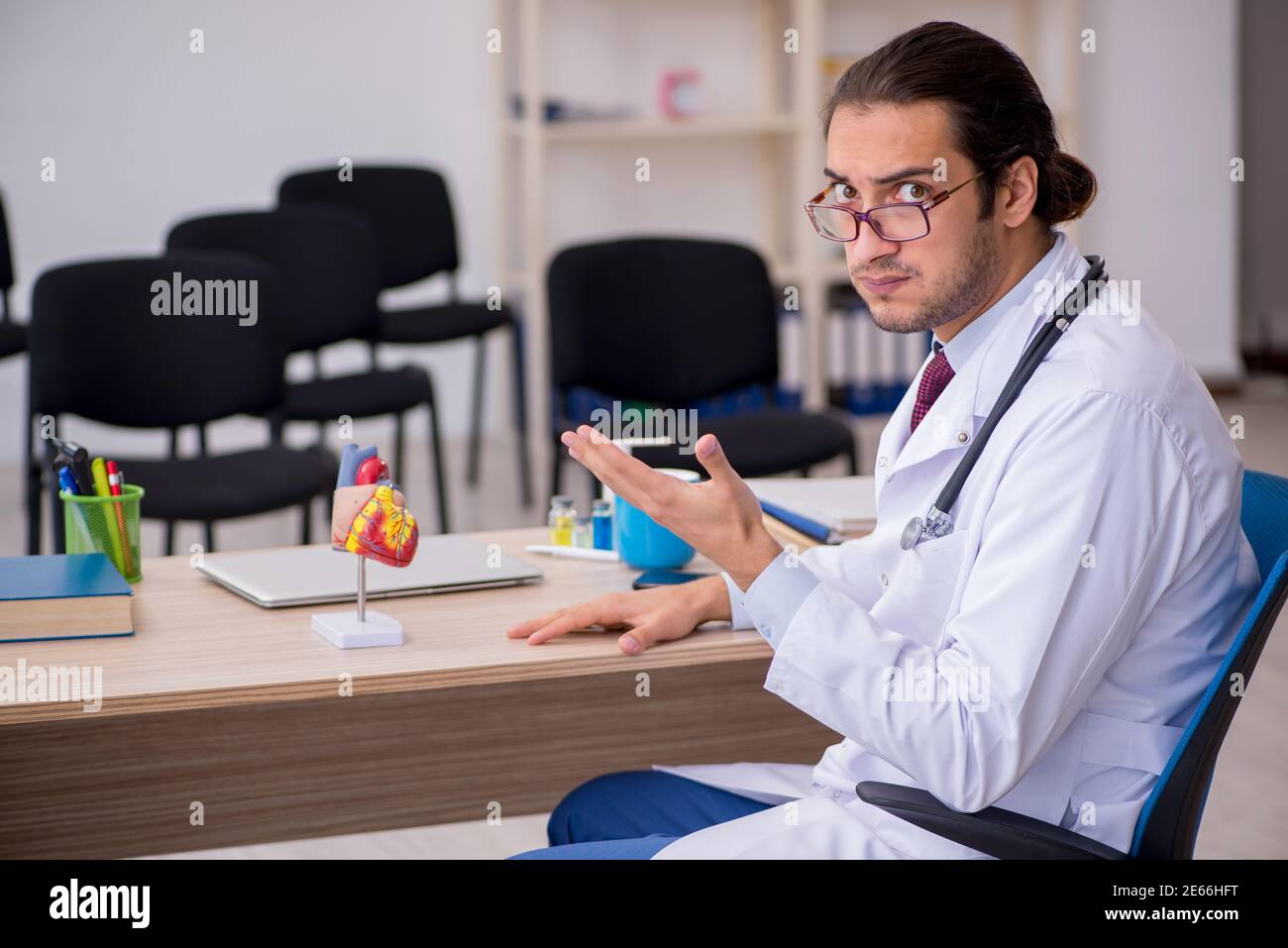 Young doctor giving seminar in the classroom Stock Photo - Alamy