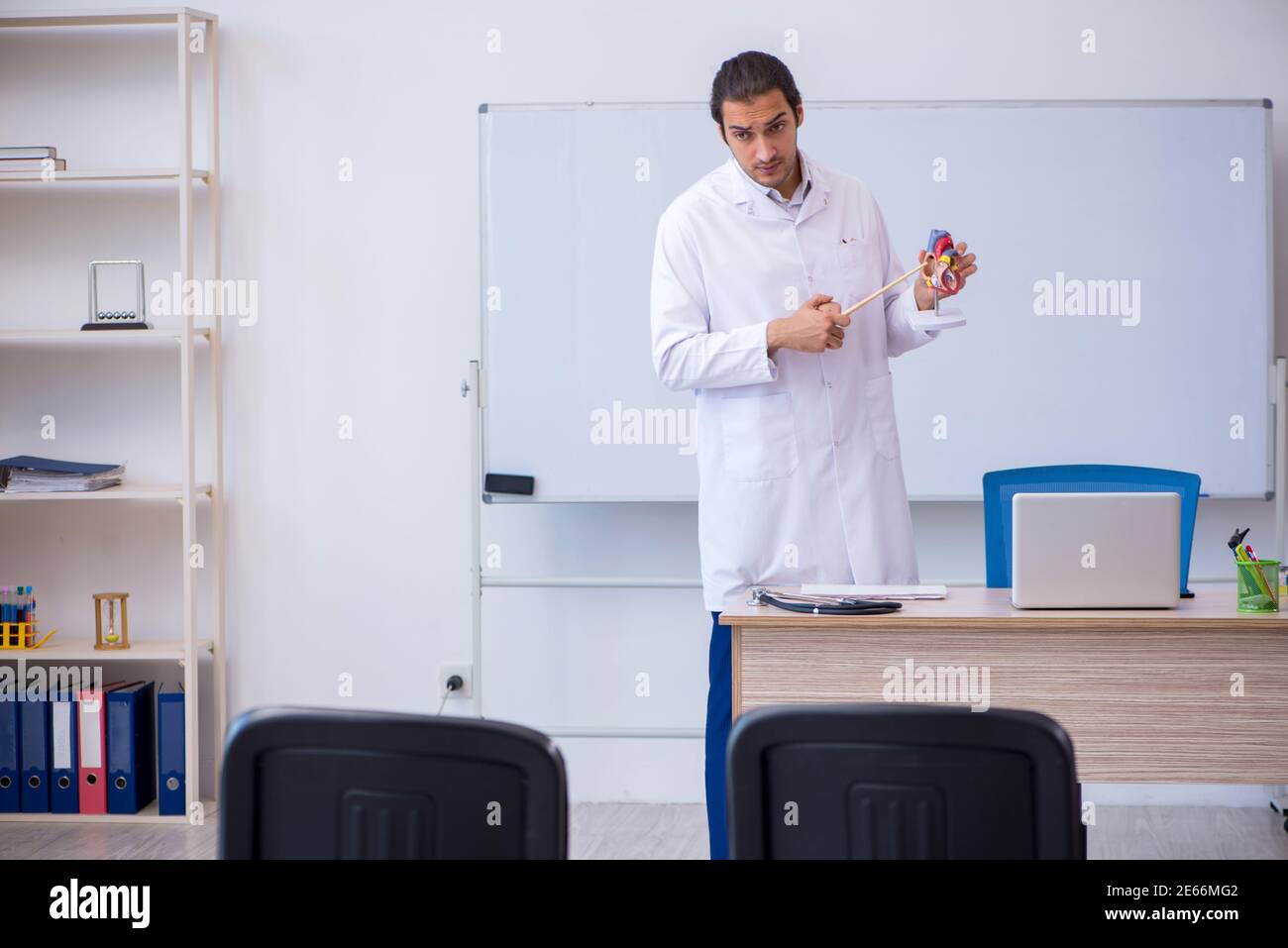Young doctor cardiologist giving seminar in the classroom Stock Photo ...