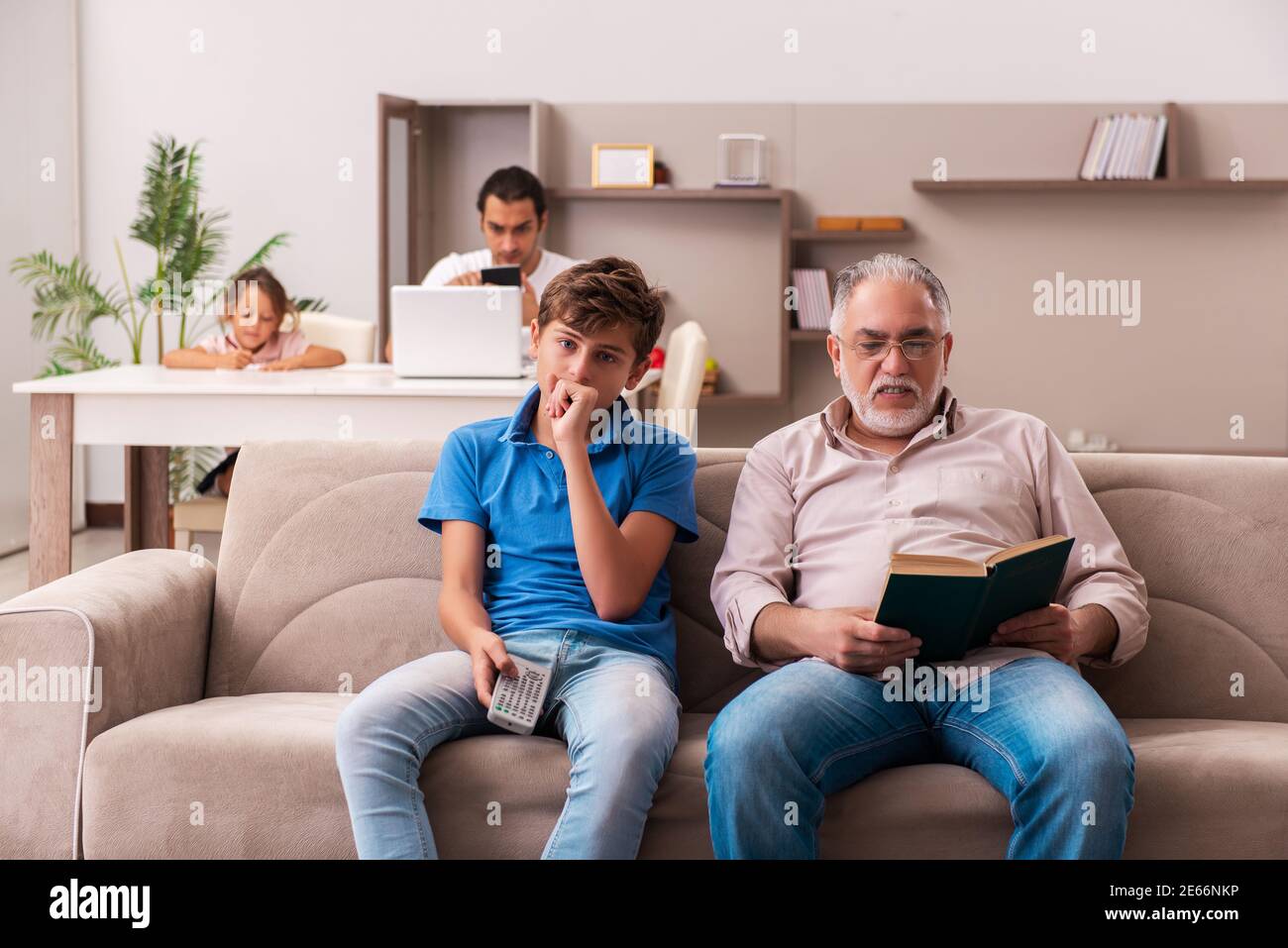Three generations at home in early development concept Stock Photo - Alamy