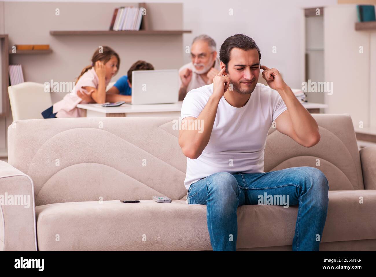 Three generations at home in early development concept Stock Photo - Alamy