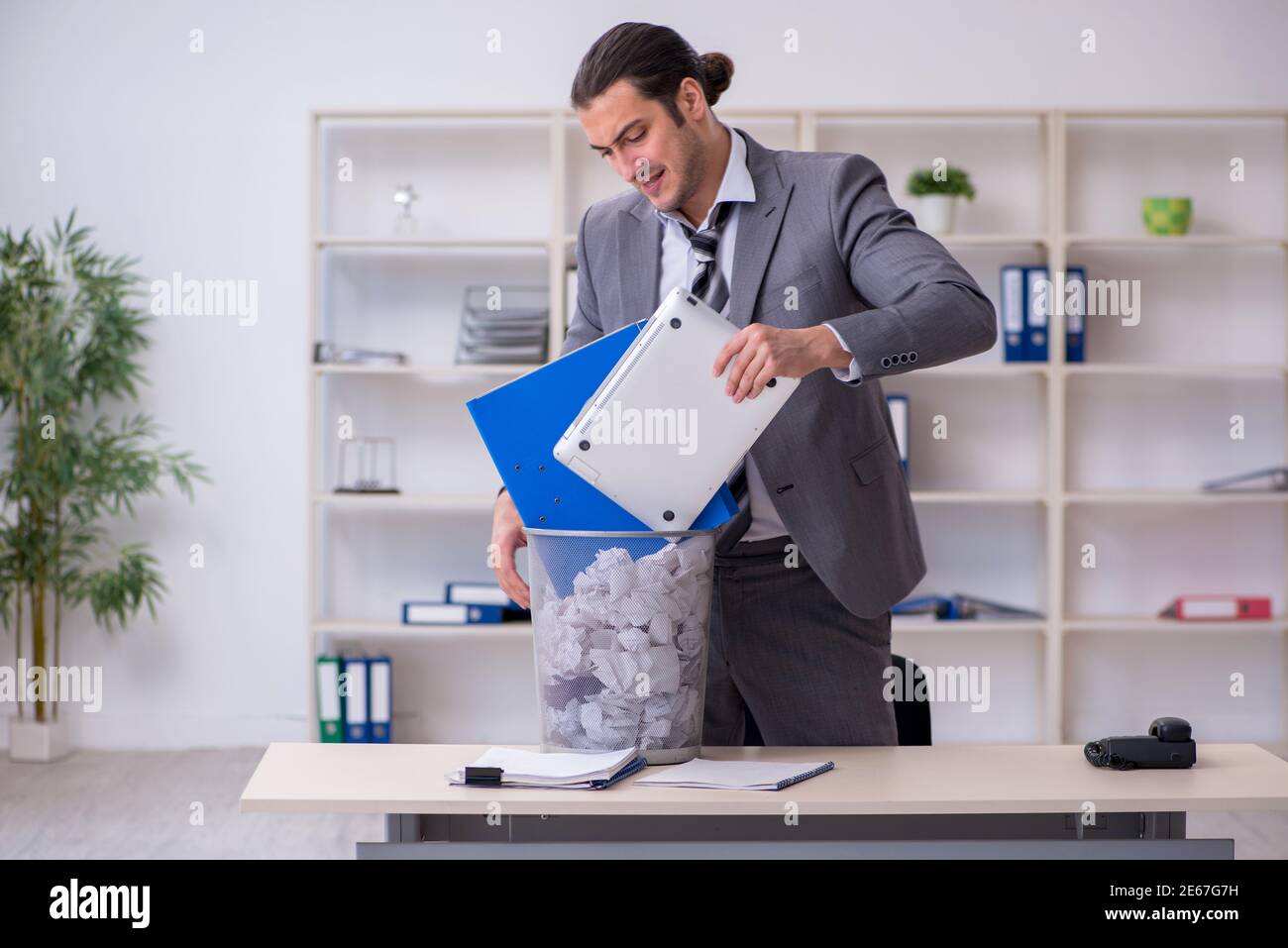 Businessman throwing paper bin hi-res stock photography and images - Alamy